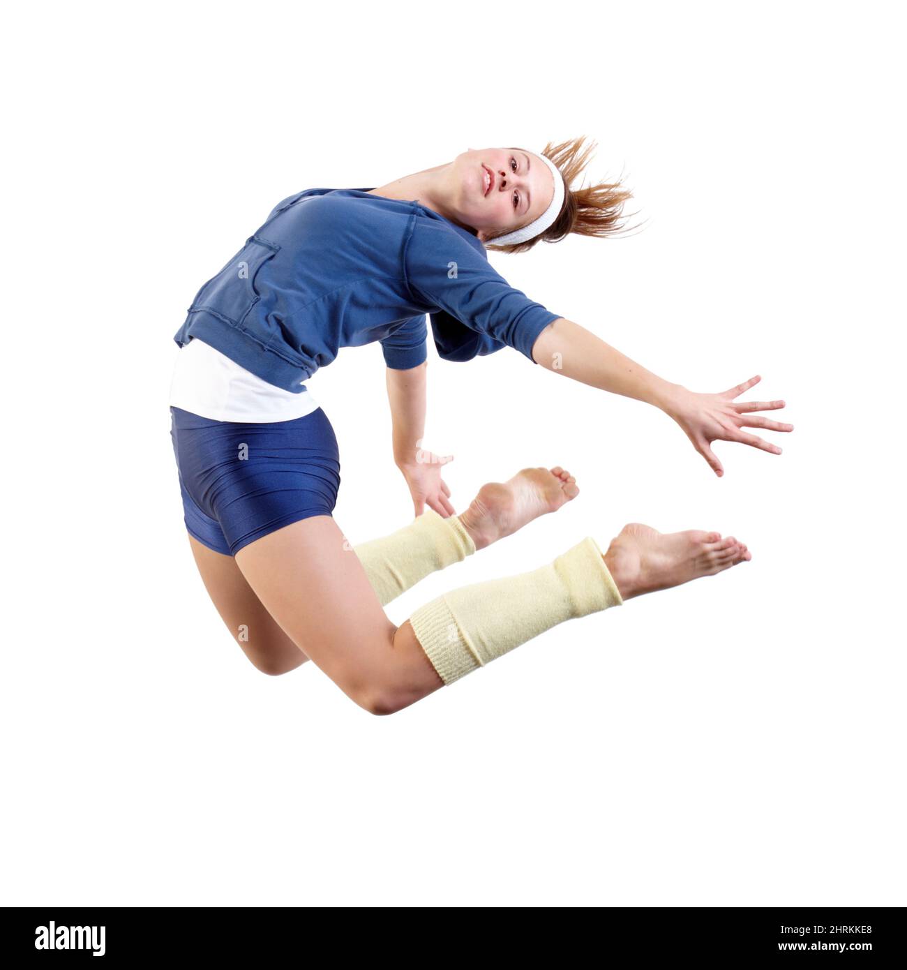 Lost in the music. Young dancer jumping against a white background ...