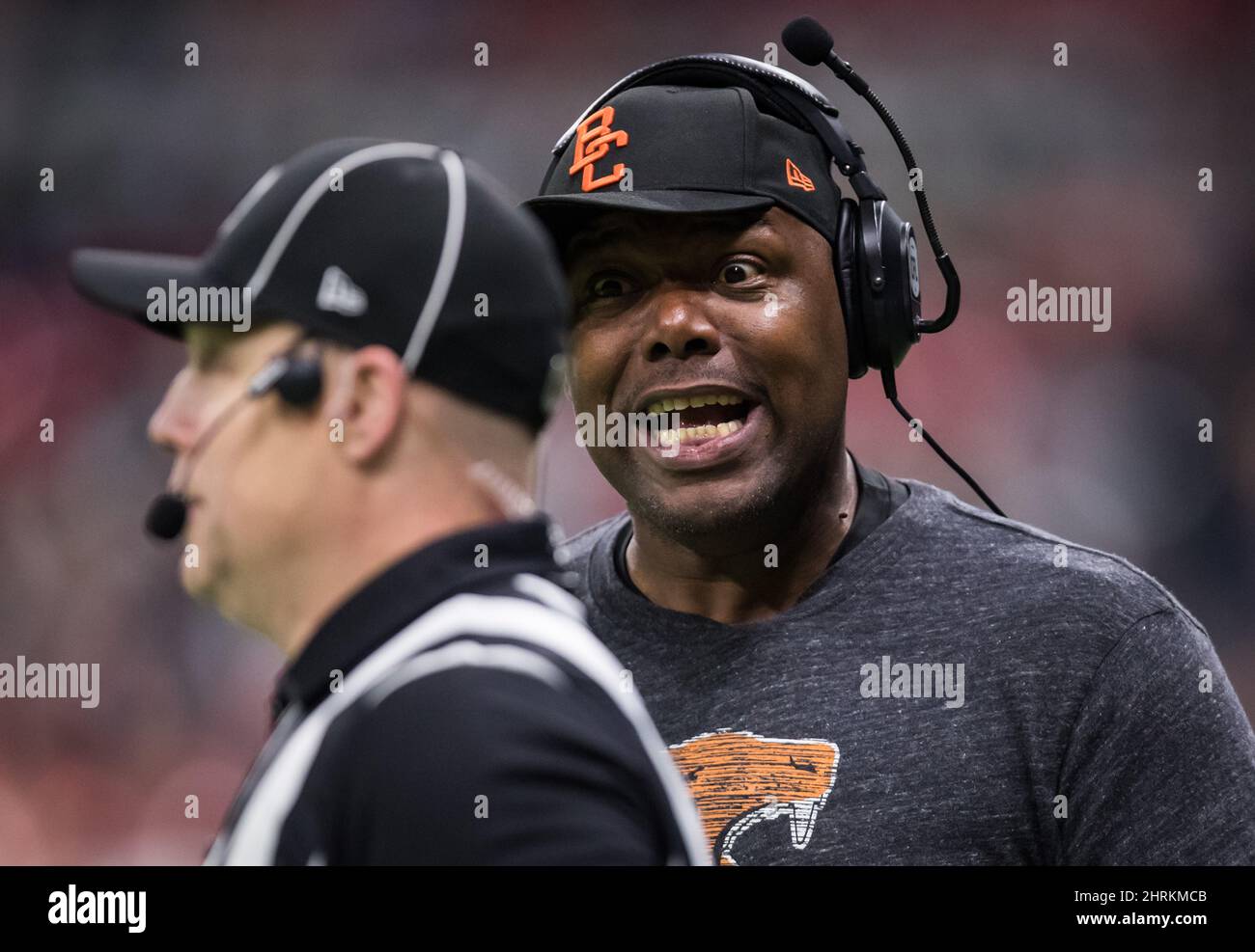 B.C. Lions head coach DeVone Claybrooks, back right, questions umpire ...