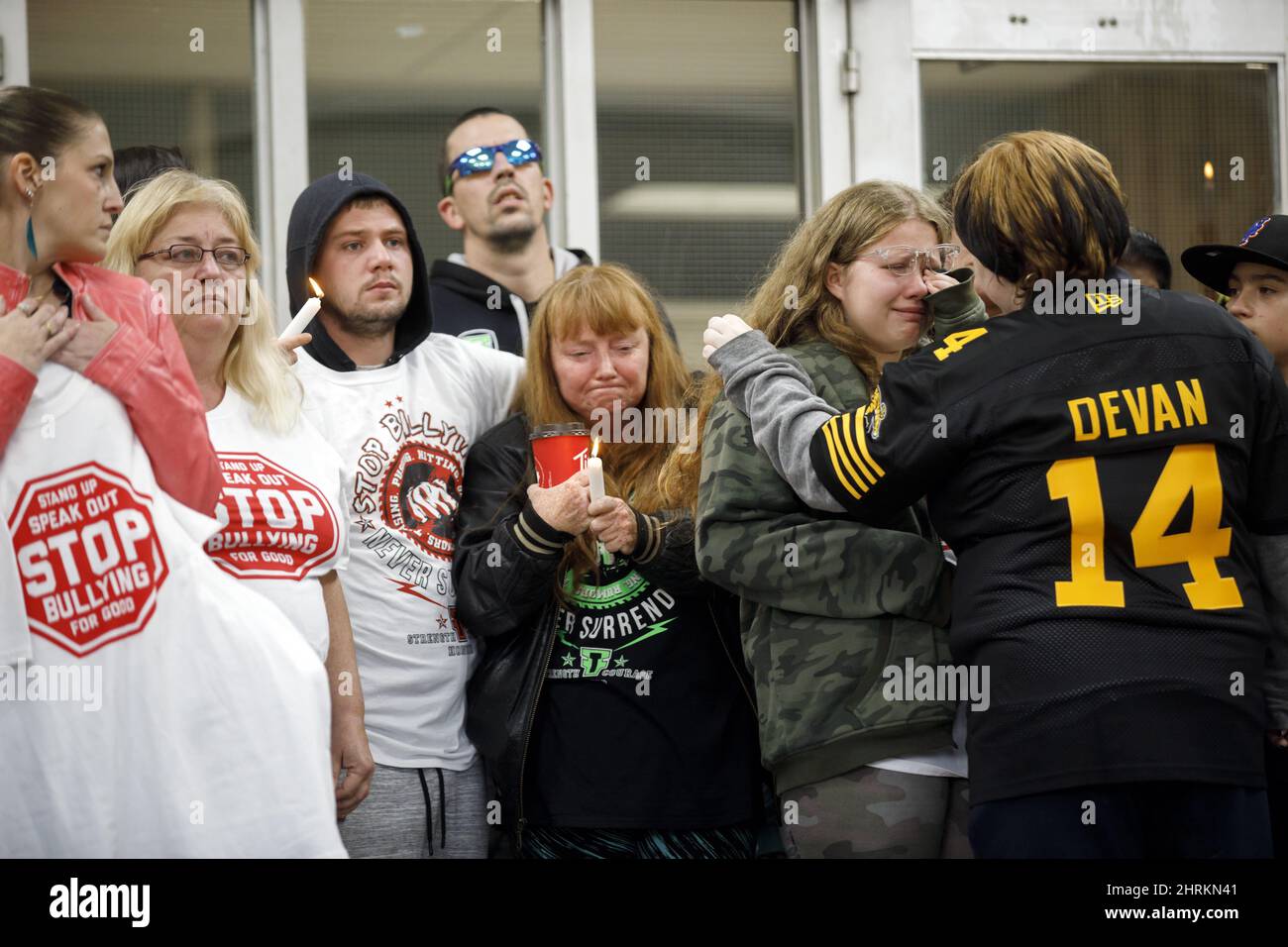 Shari-Ann Bracci-Selvey, centre, fights back tears at a vigil for her ...