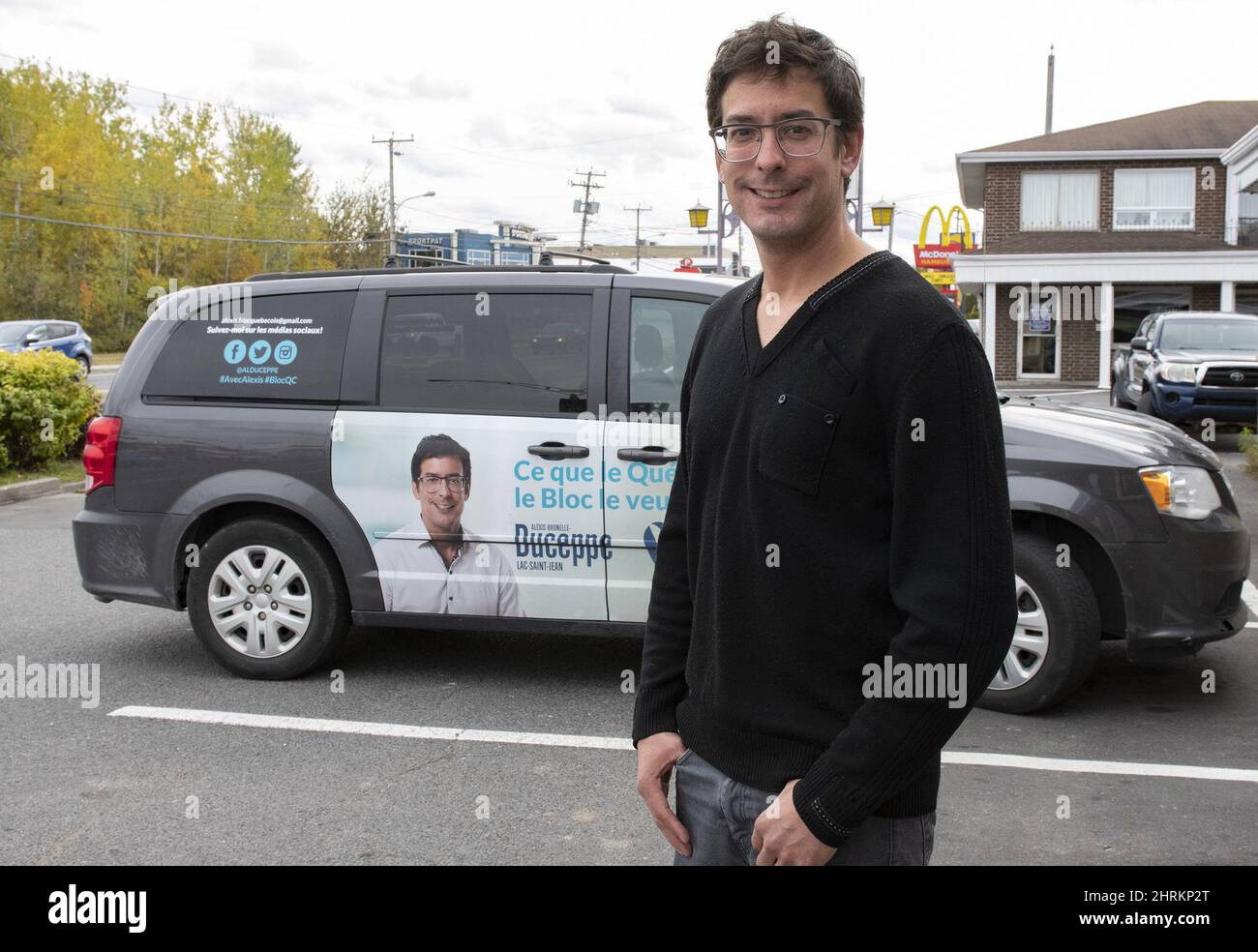 Bloc Quebecois candidate Alexis Brunelle-Duceppe stands in front of his ...