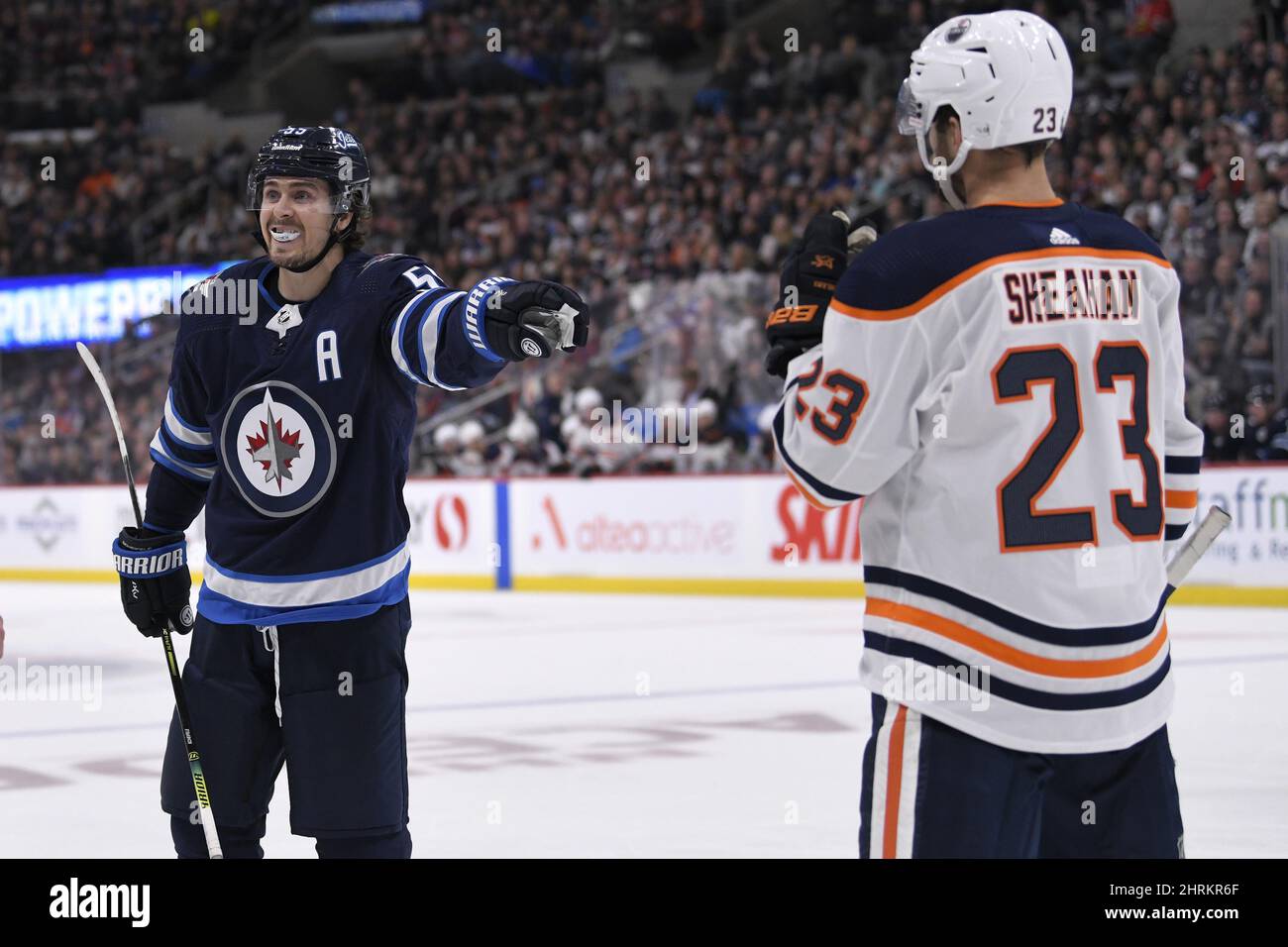 Winnipeg Jets' Mark Scheifele (55) points at Edmonton Oilers' Riley ...