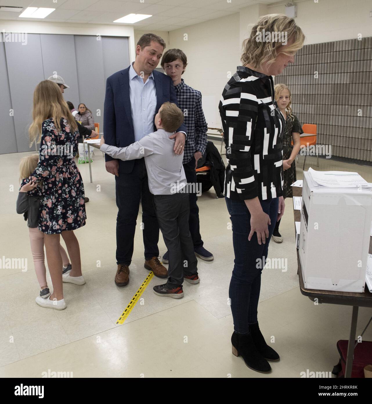 Conservative leader Andrew Scheer gets a hug from his son Henry as he ...