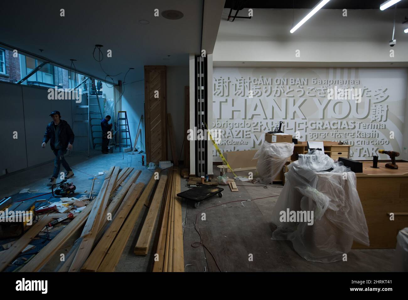Construction workers are seen at a Sungiven Foods grocery store under ...