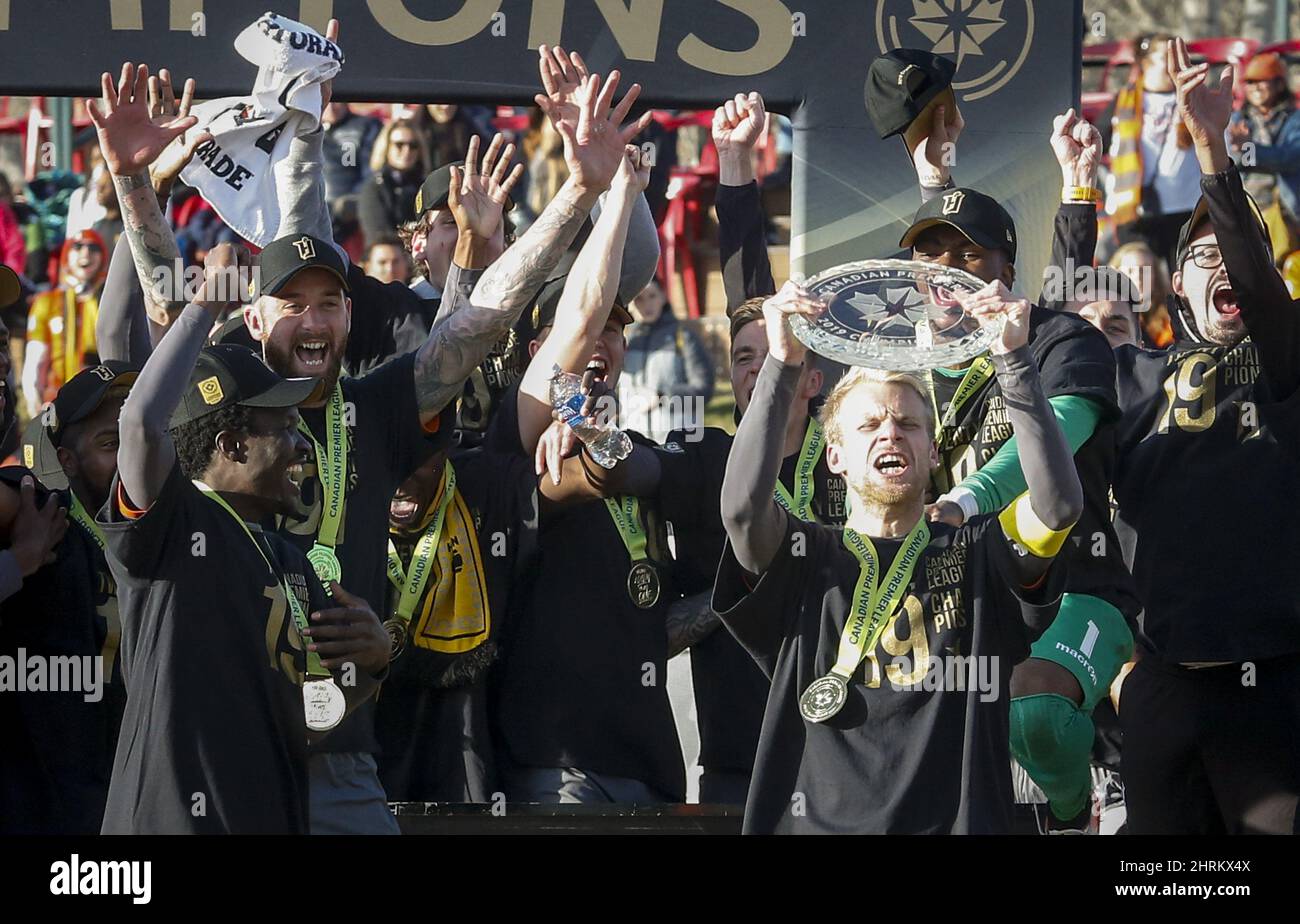 Hamilton Forge's Kyle Bekker, centre right, holds the trophy after ...