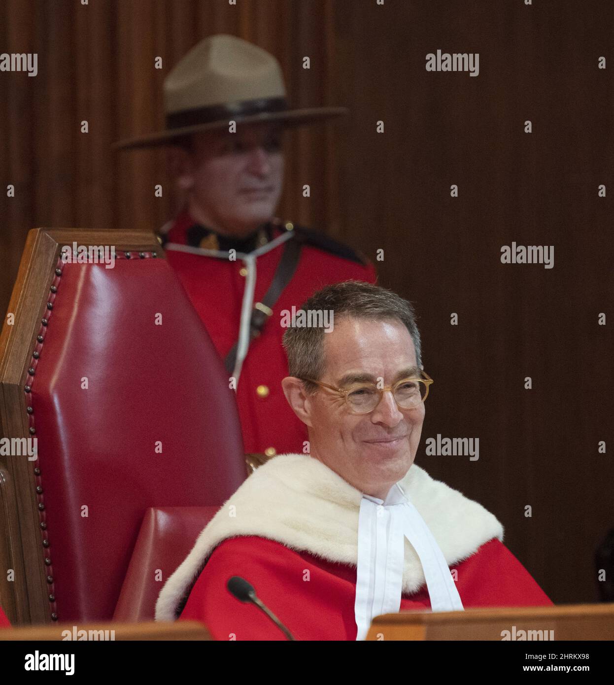 Supreme Court Justice Nicholas Kasirer smiles as he listens to speaks ...