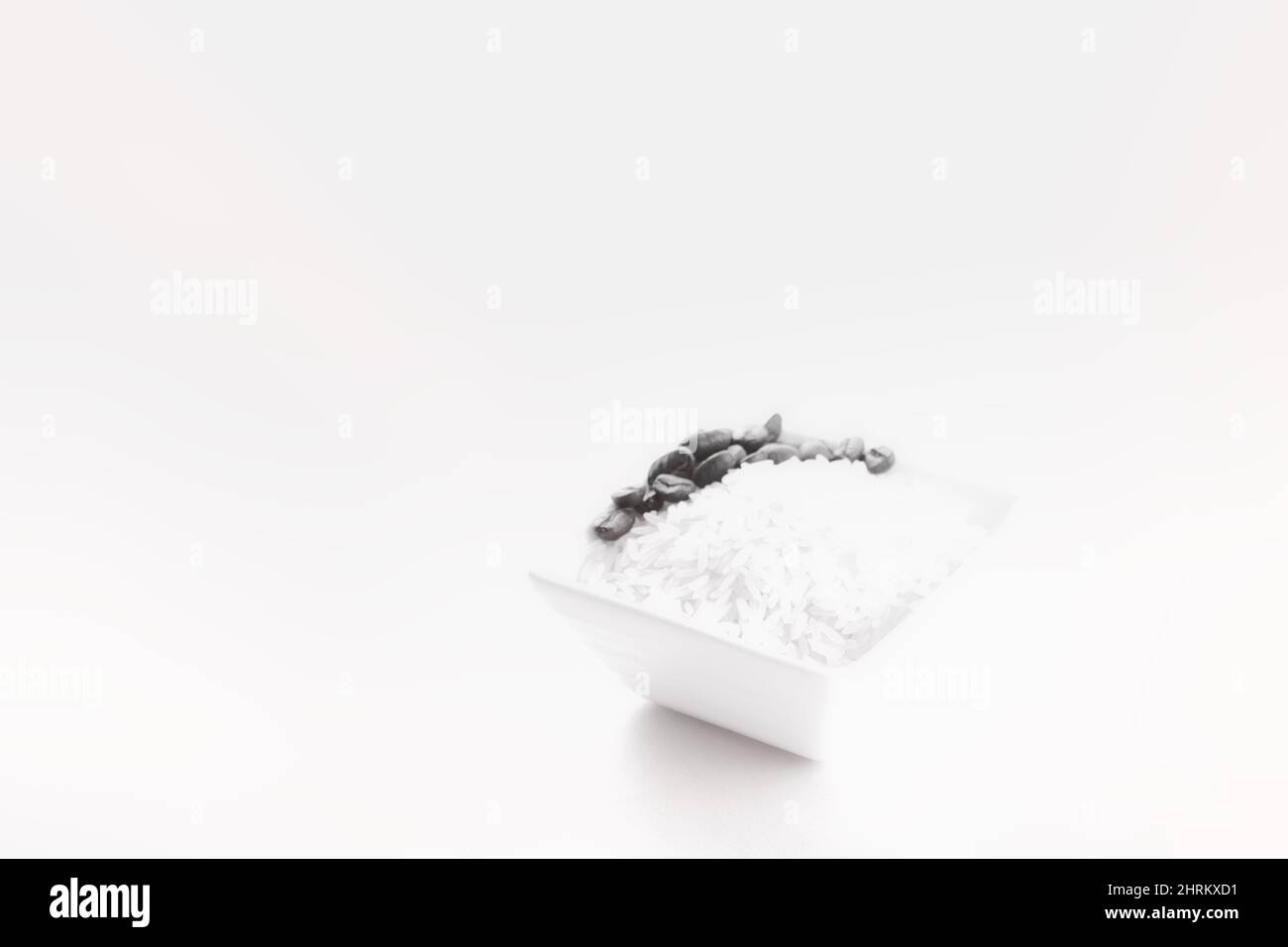 Grayscale of rice in a white bowl with white background Stock Photo - Alamy