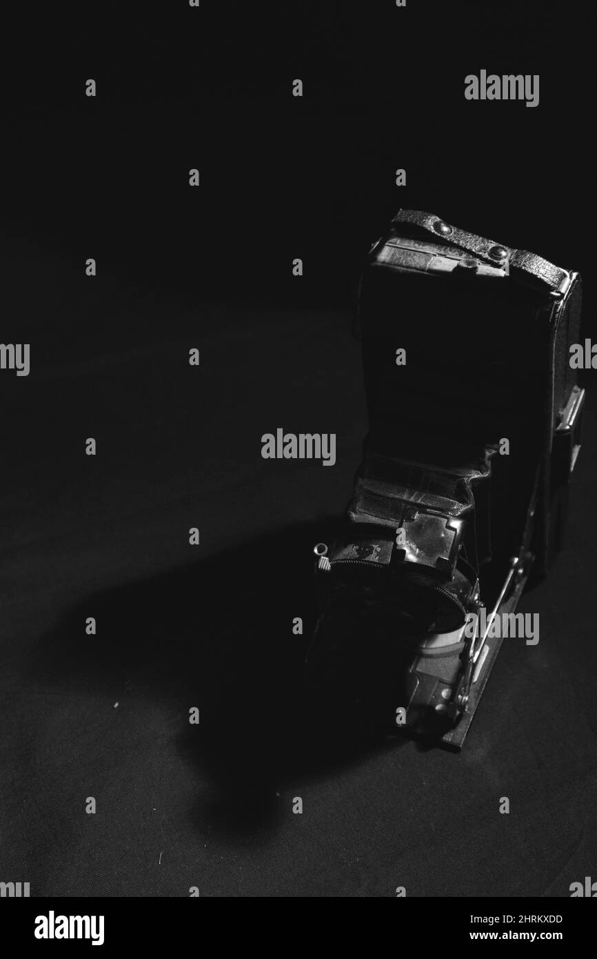 Grayscale of a vintage camera on a table Stock Photo - Alamy