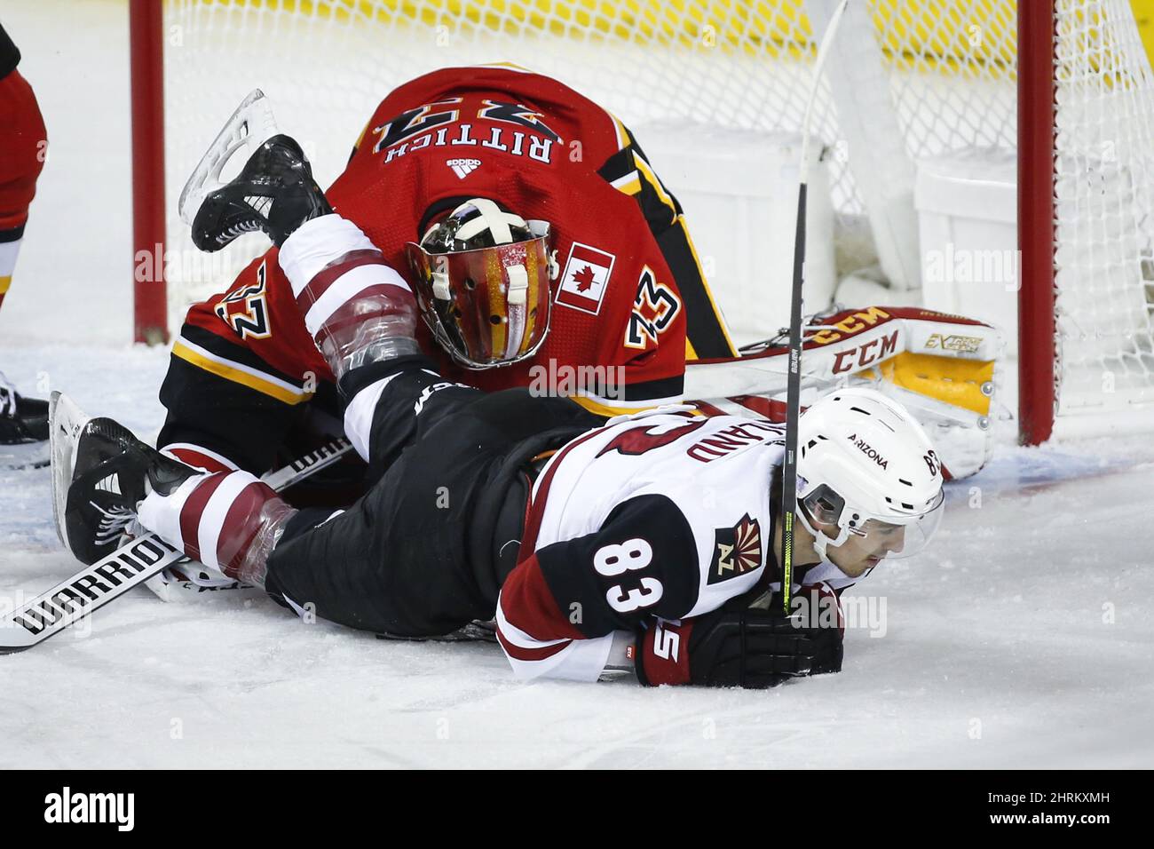 Arizona Coyotes' Conor Garland, crashes over Calgary Flames goalie ...