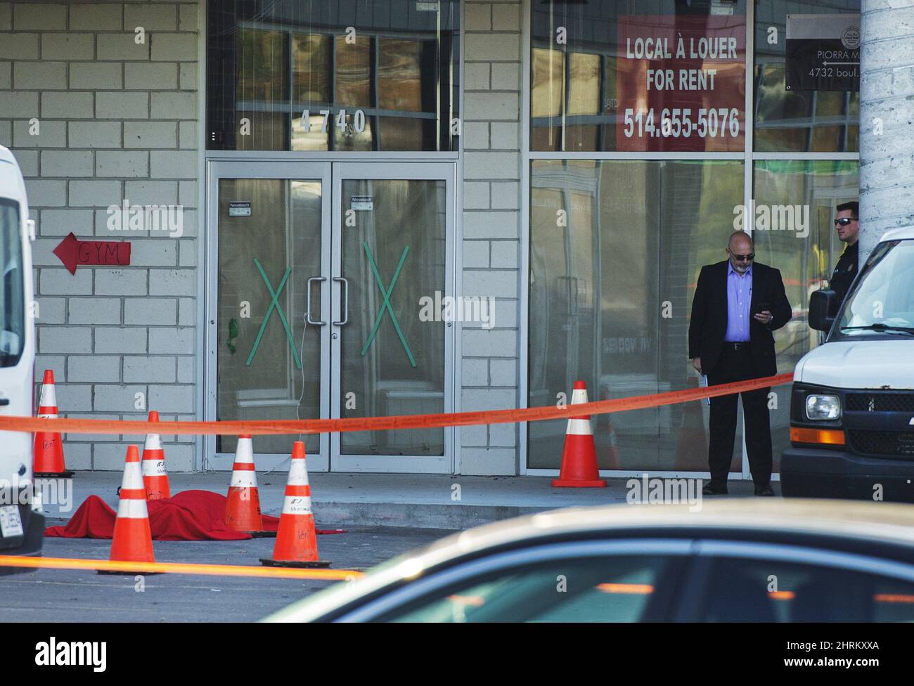 Investigators stand near the body of alleged mob boss Andrew Scoppa ...
