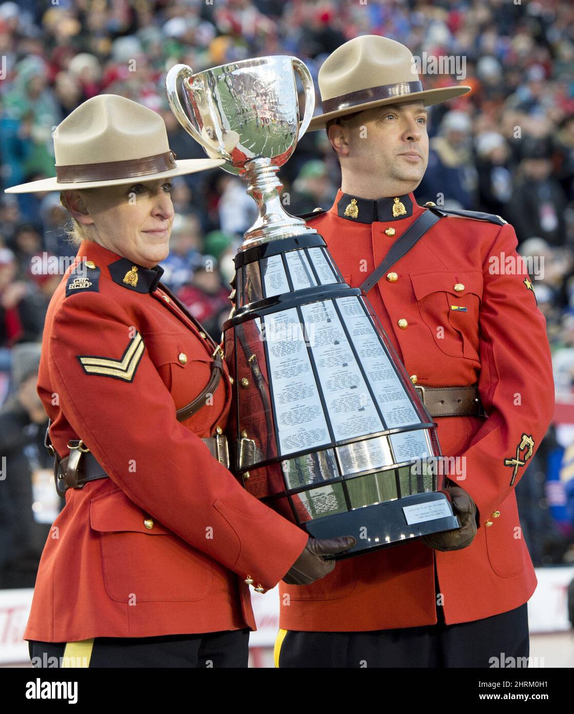 Members of the RCMP carry the Grey Cup during the 107th Grey Cup in ...