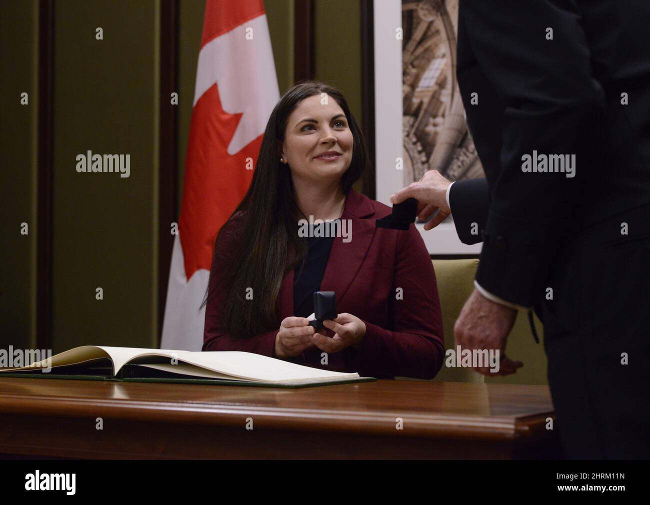 Jenica Atwin is presented with her Member of Parliament pin as she ...