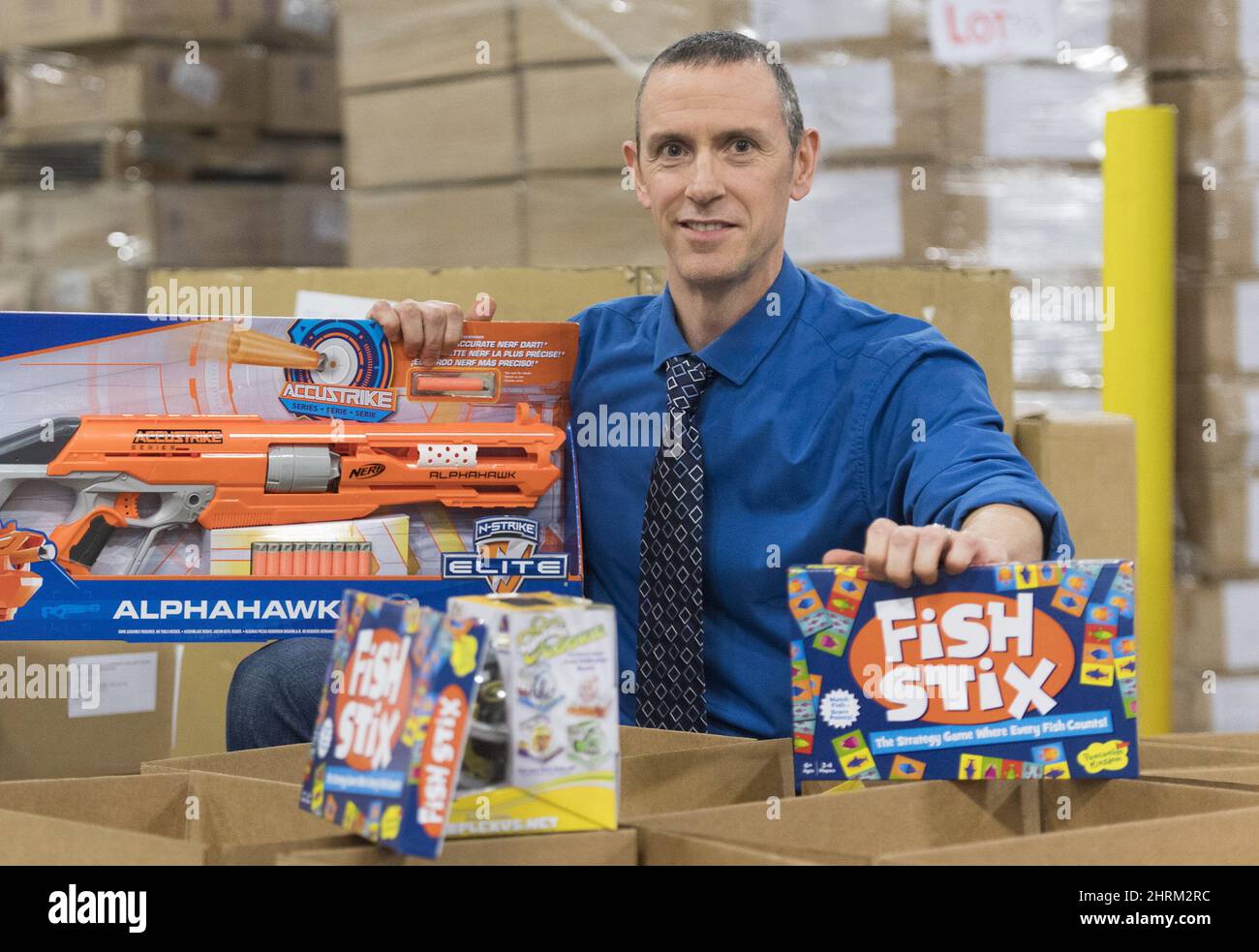 GCSurplus director general Nicholas Trudel poses with toys at a ...