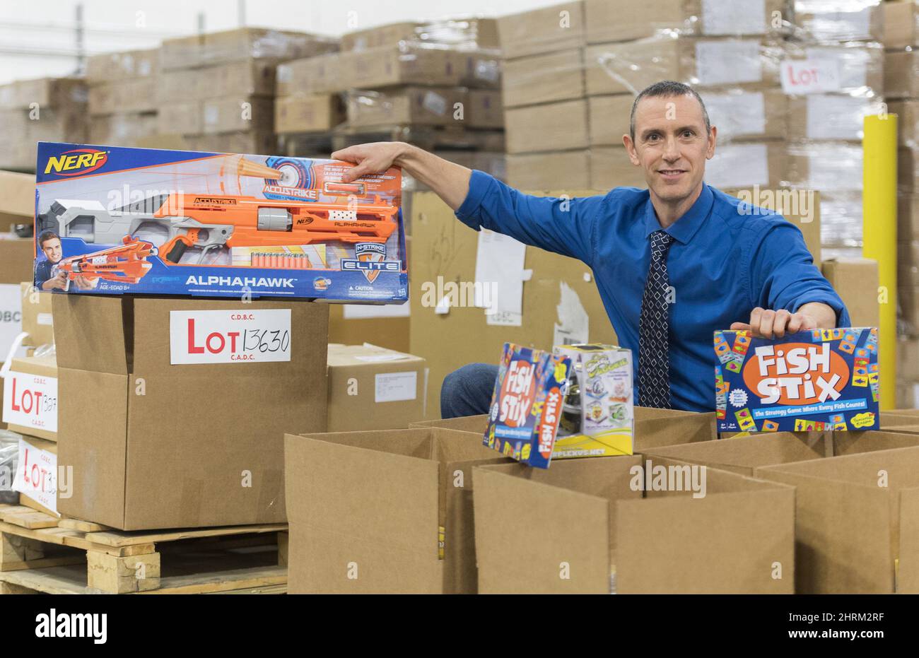 GCSurplus director general Nicholas Trudel poses with toys at a ...