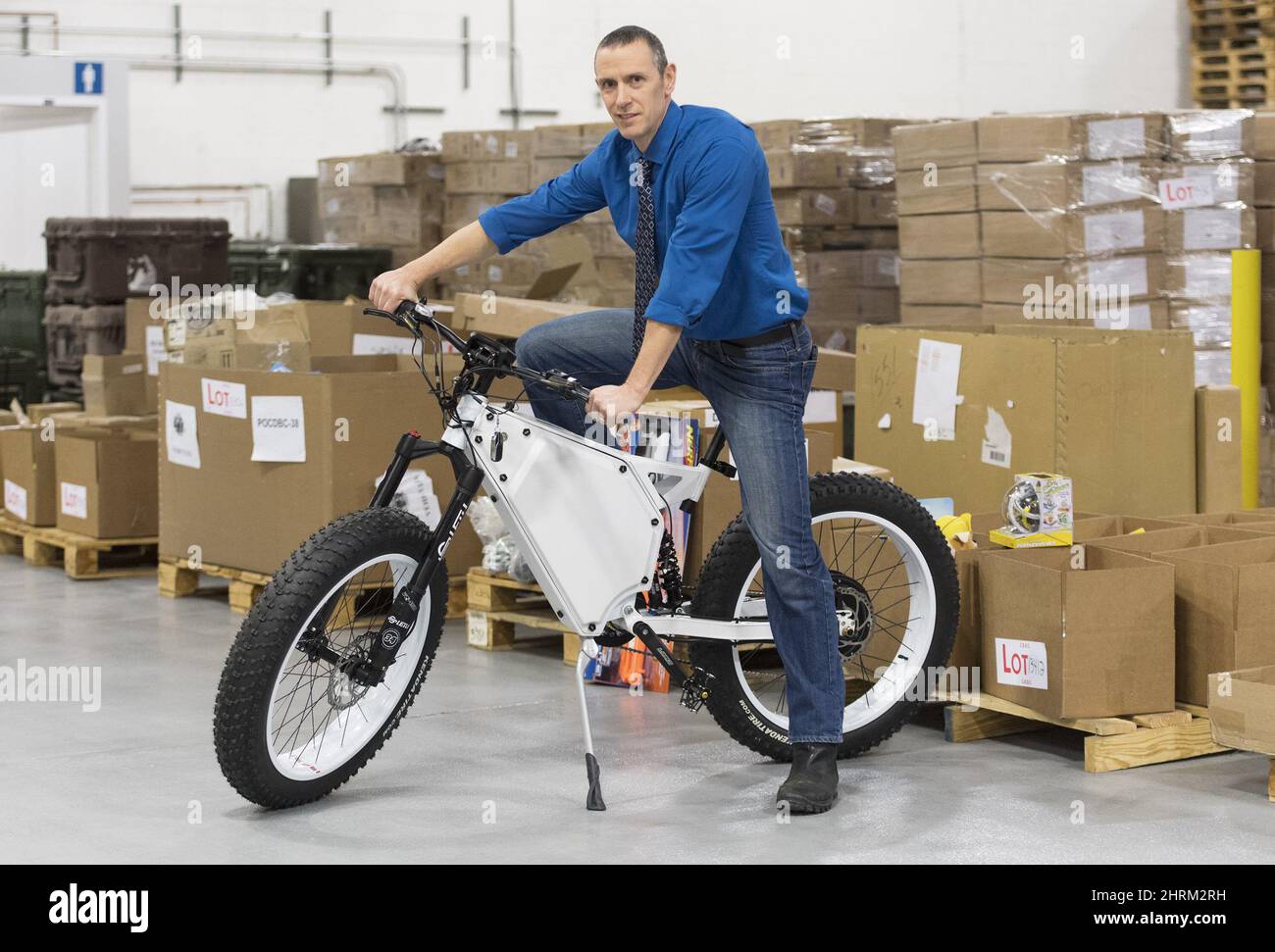 GCSurplus director general Nicholas Trudel poses on an electric bicycle ...