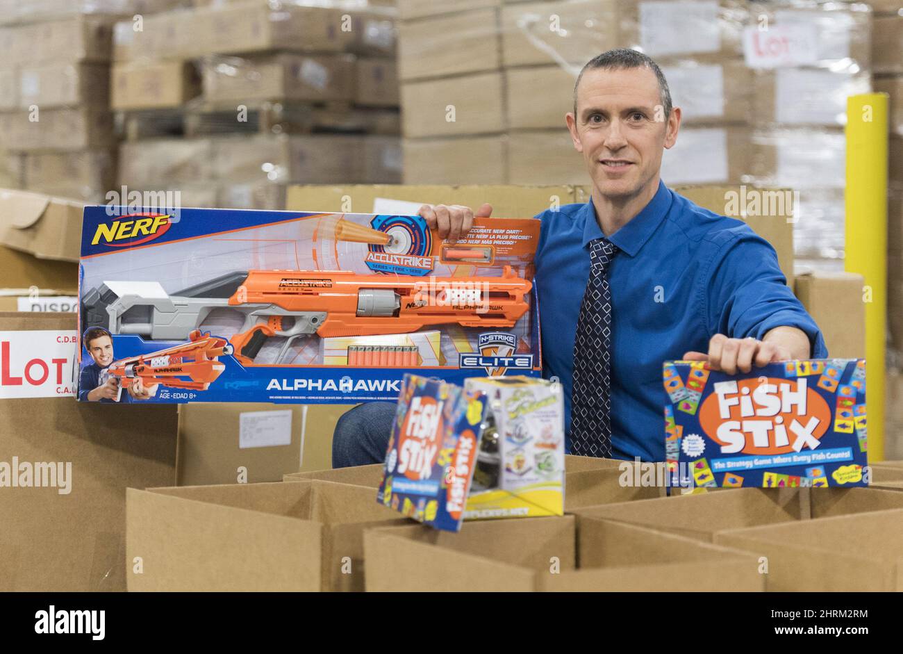 GCSurplus director general Nicholas Trudel poses with toys at a ...