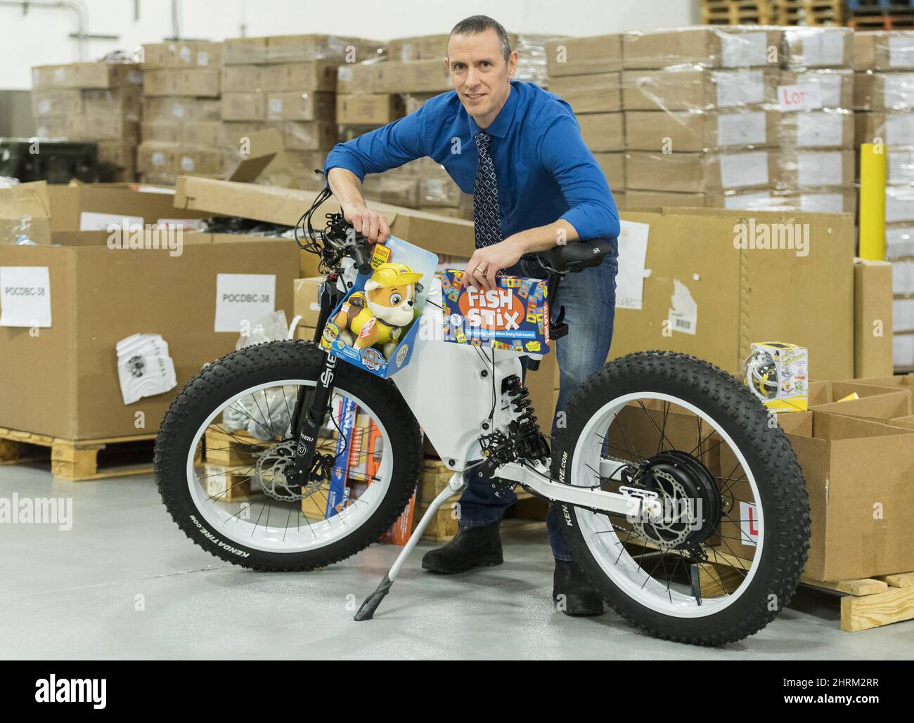 GCSurplus director general Nicholas Trudel poses next to an electric ...