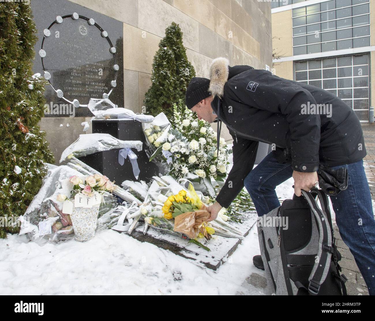 Former student Richard Gregoire places fourteen roses at the school's ...