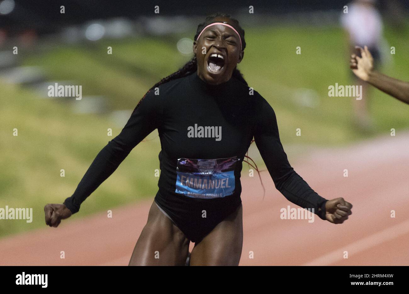 Crystal Emmanuel reacts as she crosses the finish line to win the gold ...