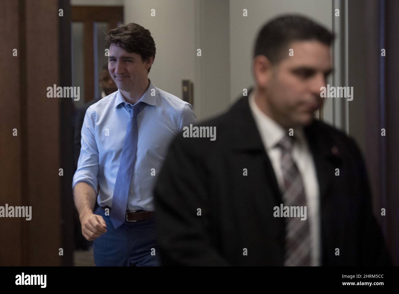 Prime Minister Justin Trudeau smiles as he leaves a caucus meeting in ...