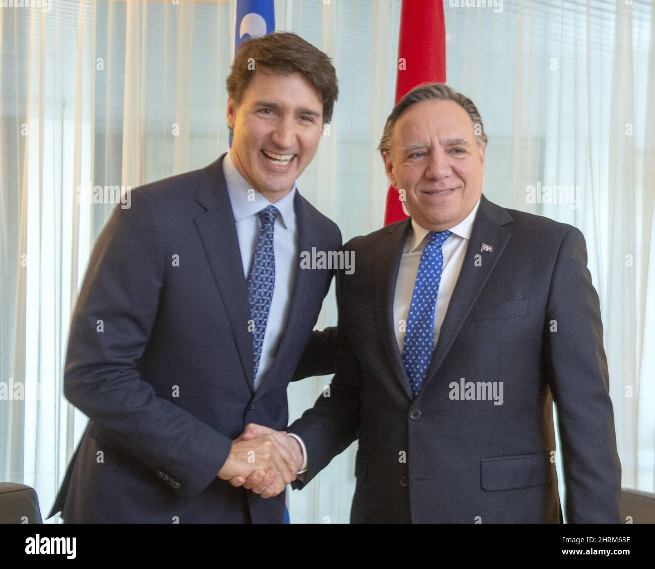 Prime Minister Justin Trudeau shakes hands with Quebec Premier Francois ...