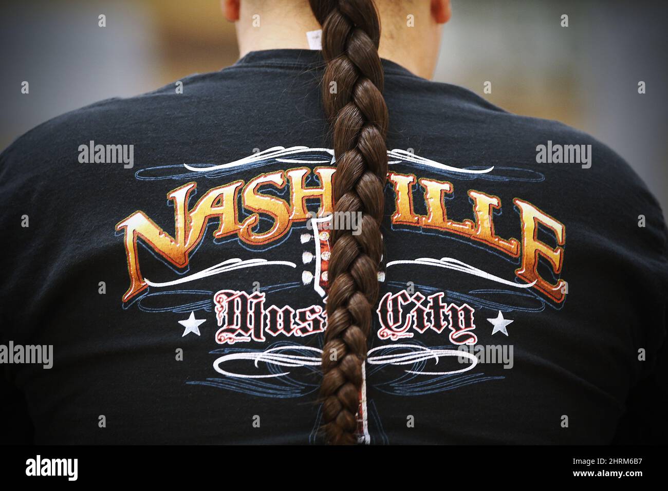 A man's braid is photographed as he speaks during a meeting of Healing ...