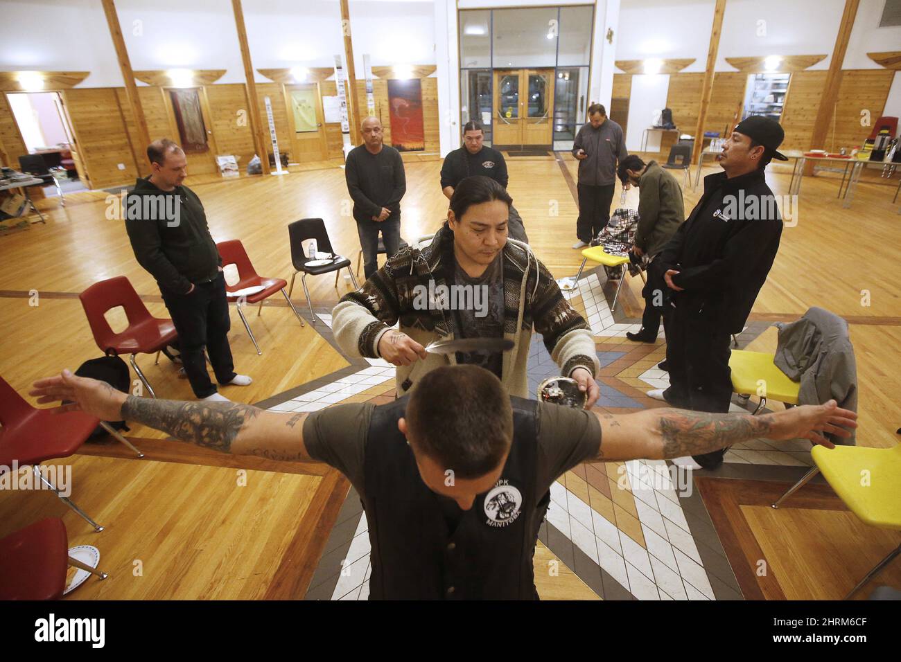 Ryan Beardy, former gang member and Healing Together founder, smudges a ...