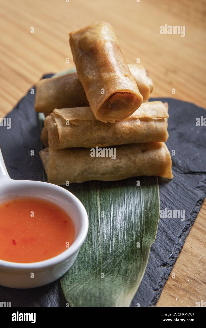 Closeup shot of freshly cooked fried pork in a spring roll wrapper ...