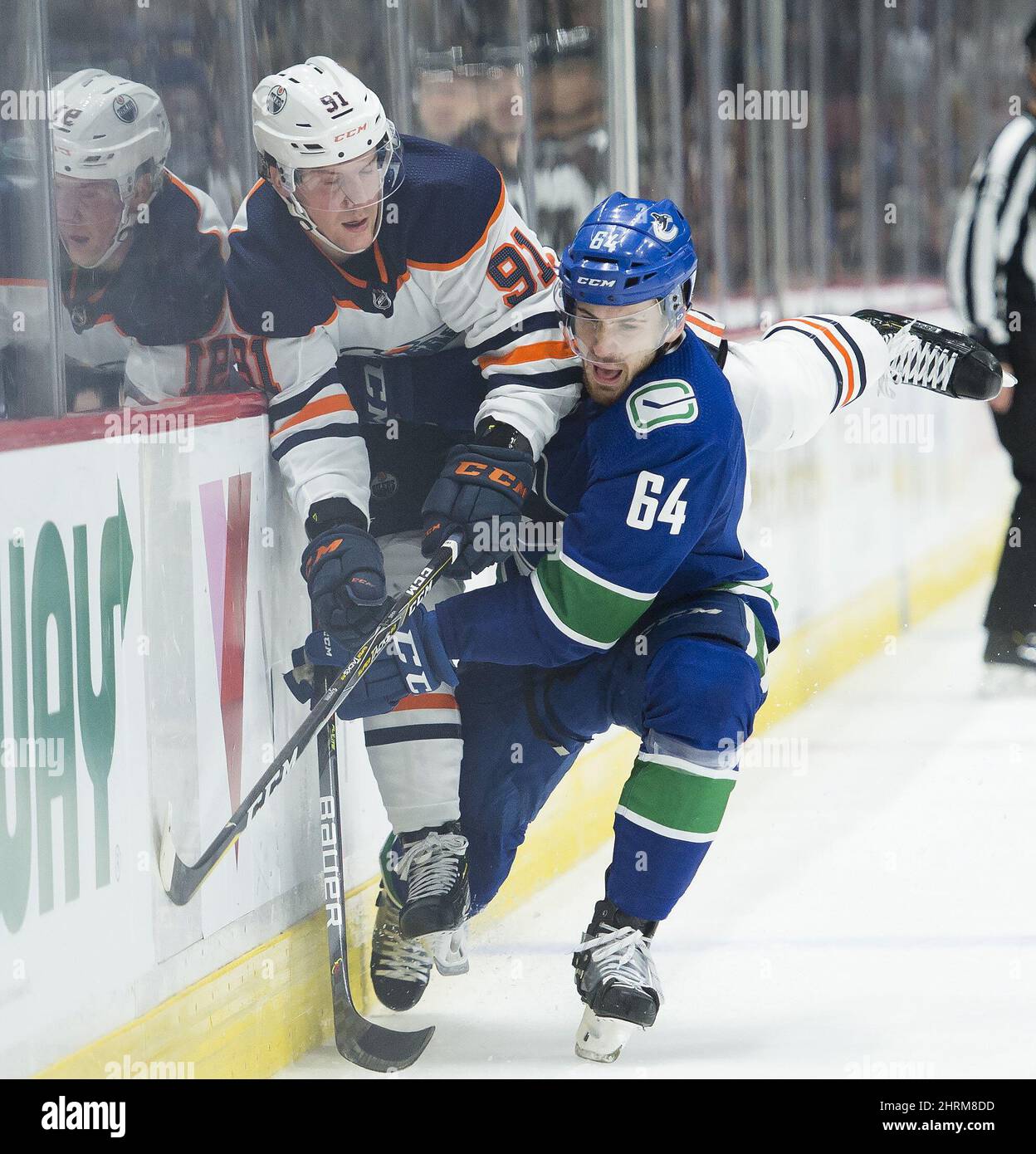 Vancouver Canucks center Tyler Motte (64) puts Edmonton Oilers center ...