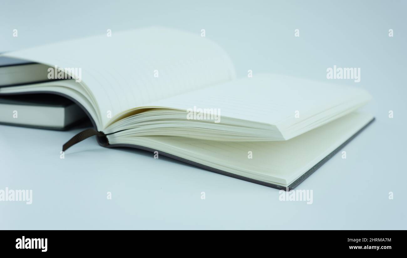 Closeup of notebooks on the table Stock Photo - Alamy