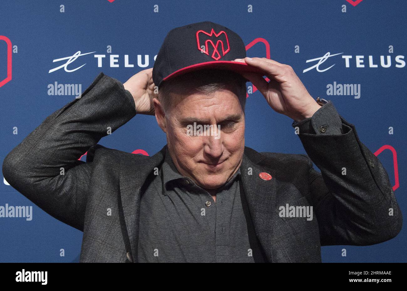 Gary Stern the new co-owner of the Montreal Alouettes tries on a cap ...