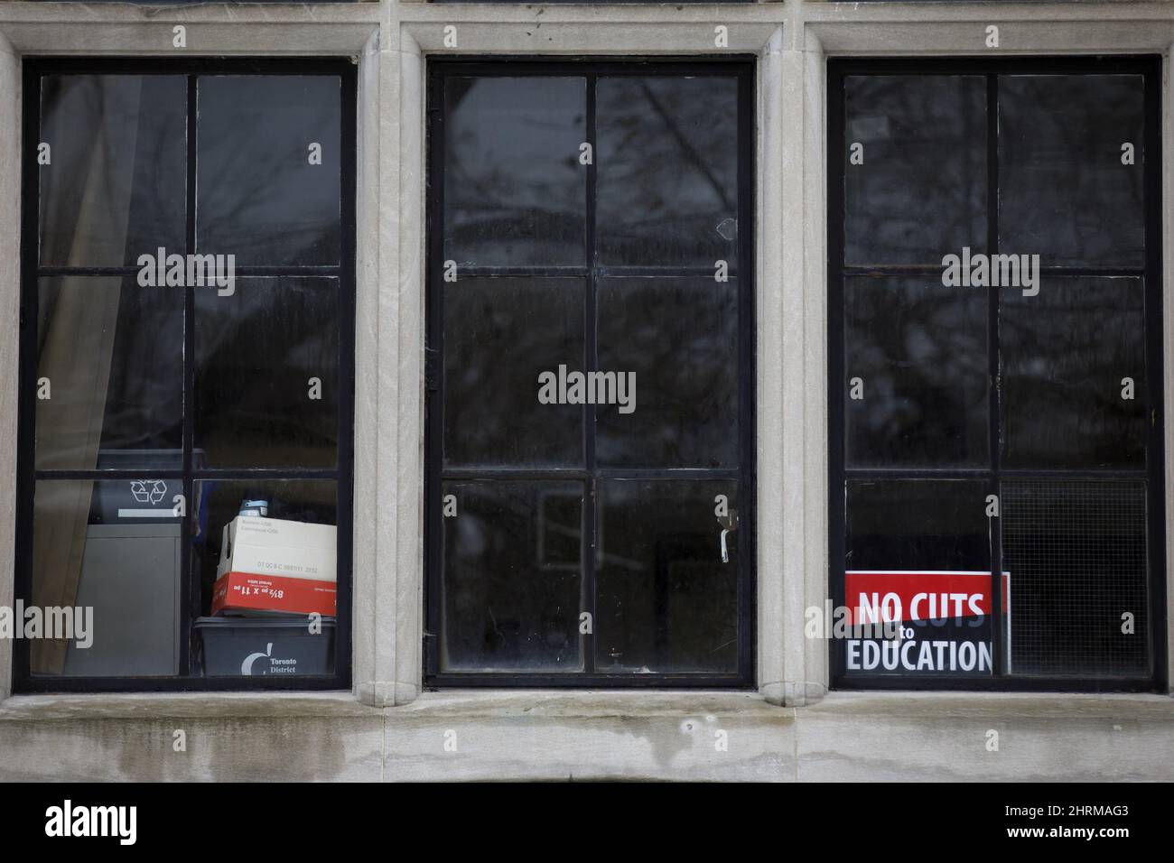 A sign is seen inside a secondary school classroom window as teachers ...