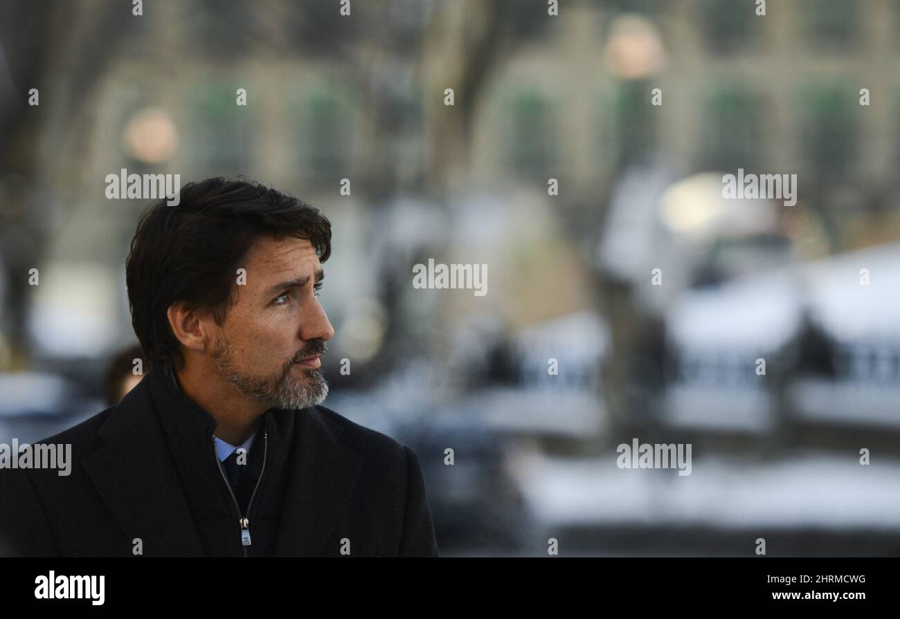 Prime Minister Justin Trudeau leaves a press conference at the National ...