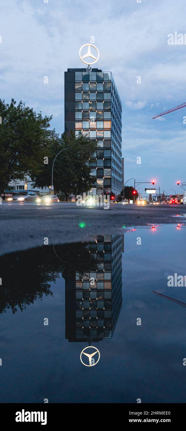 Beautiful shot of a Mercedes Benz Tower mirroring in a puddle Stock ...