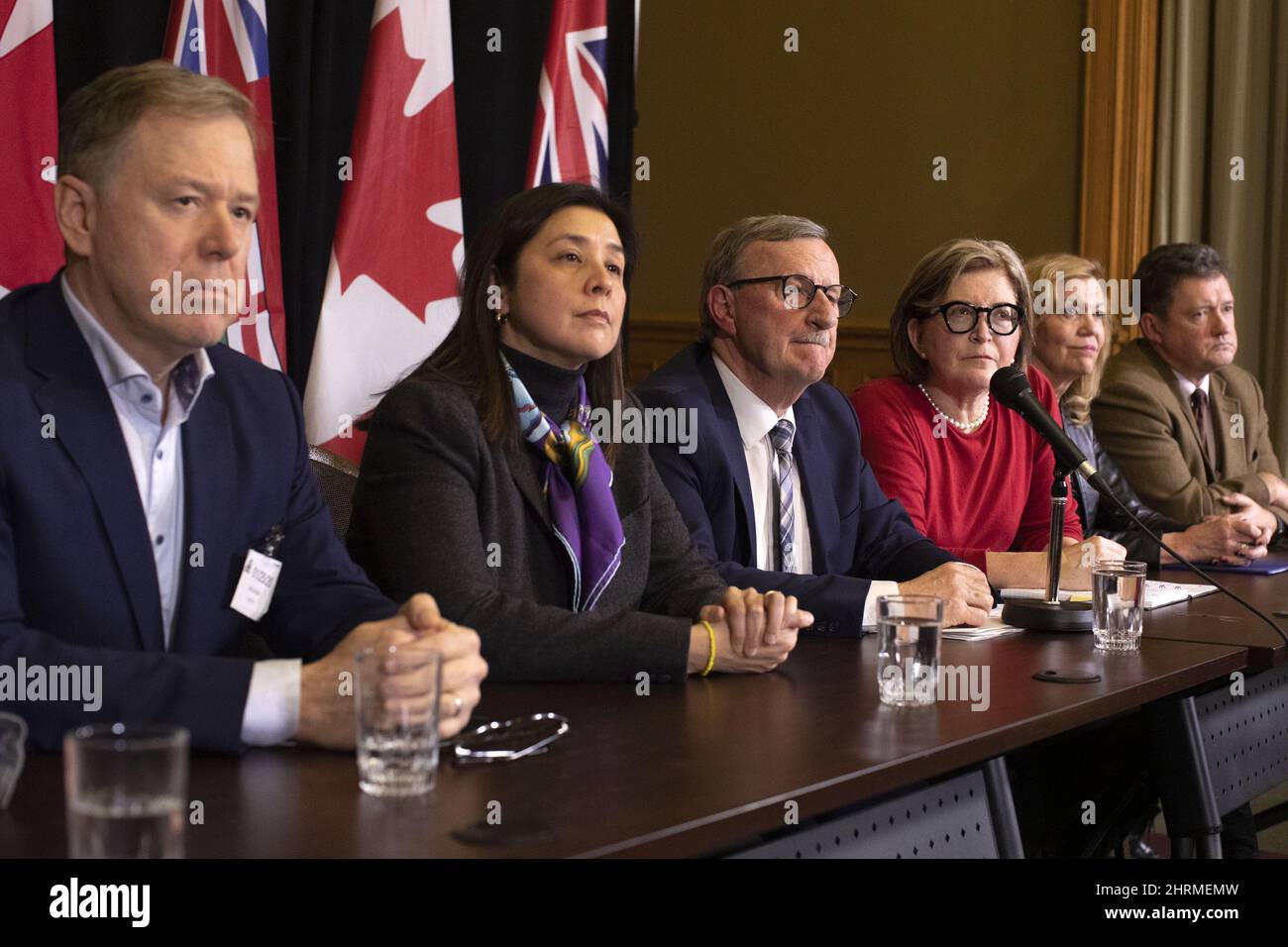 Dr. David Williams, centre, Chief Medical Officer of Health, is joined ...