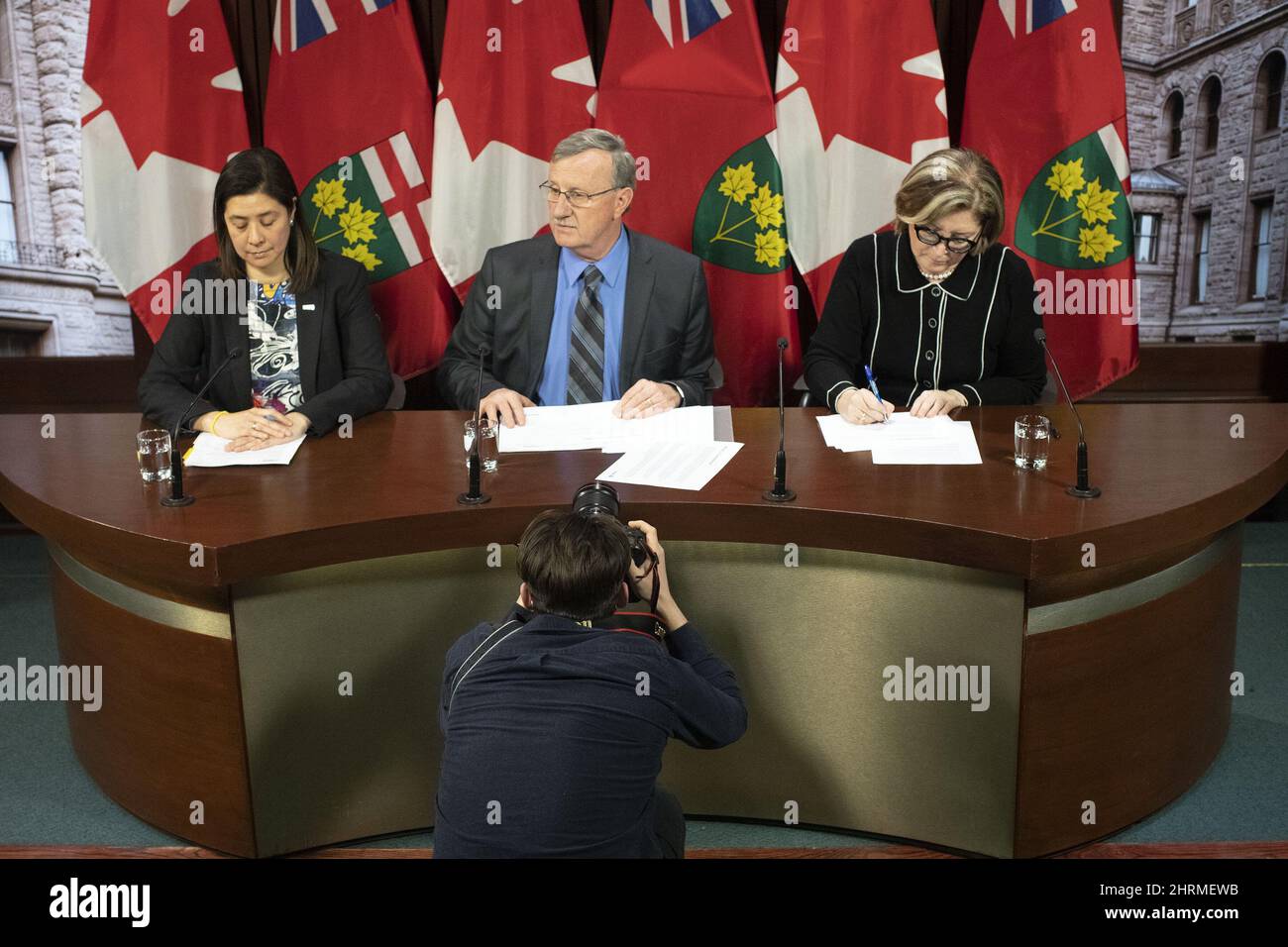Dr. David Williams, Chief Medical Officer of Health for Ontario, centre ...