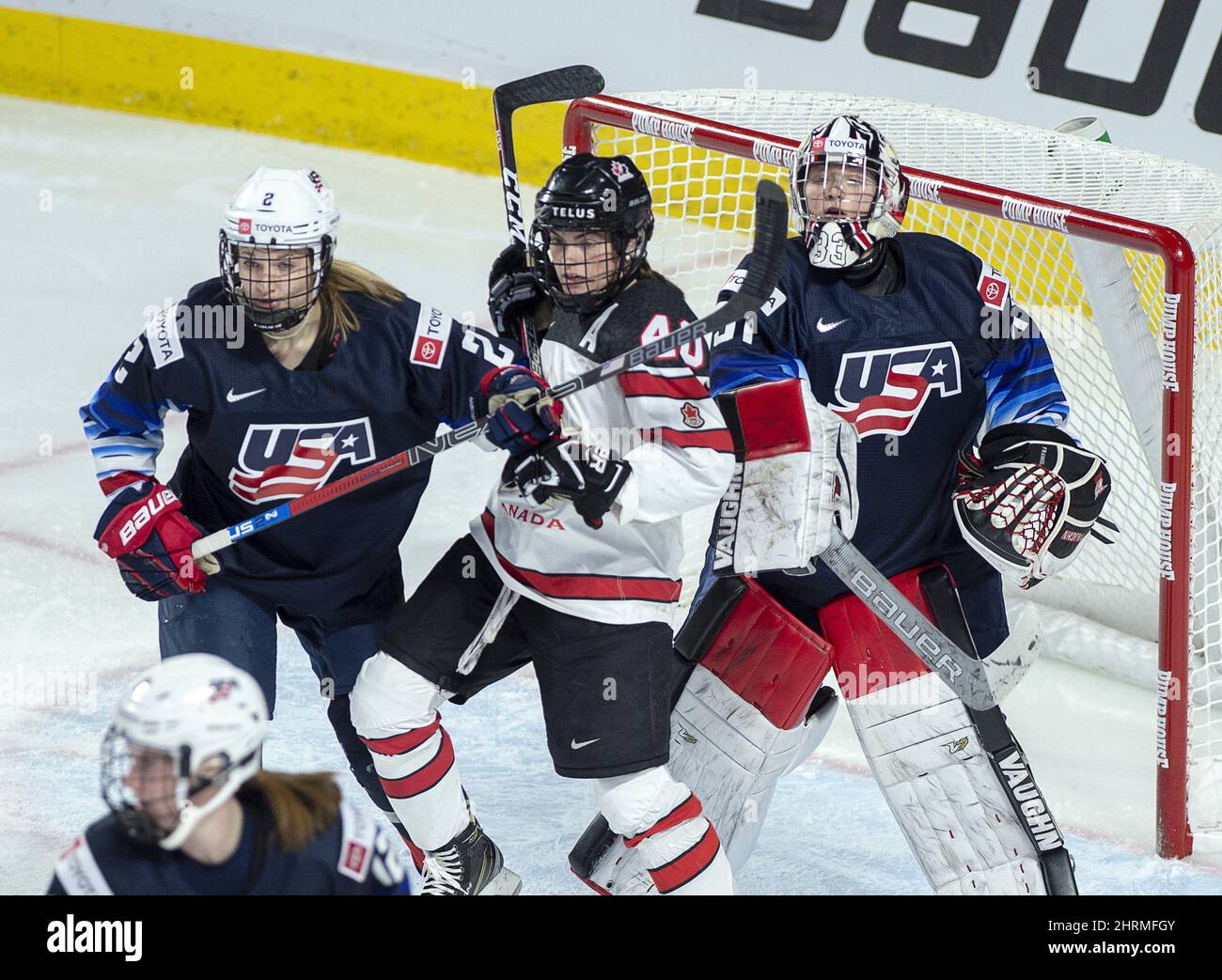 Team Canada's Blayre Turnbull, centre, is tied up between Team USA's ...