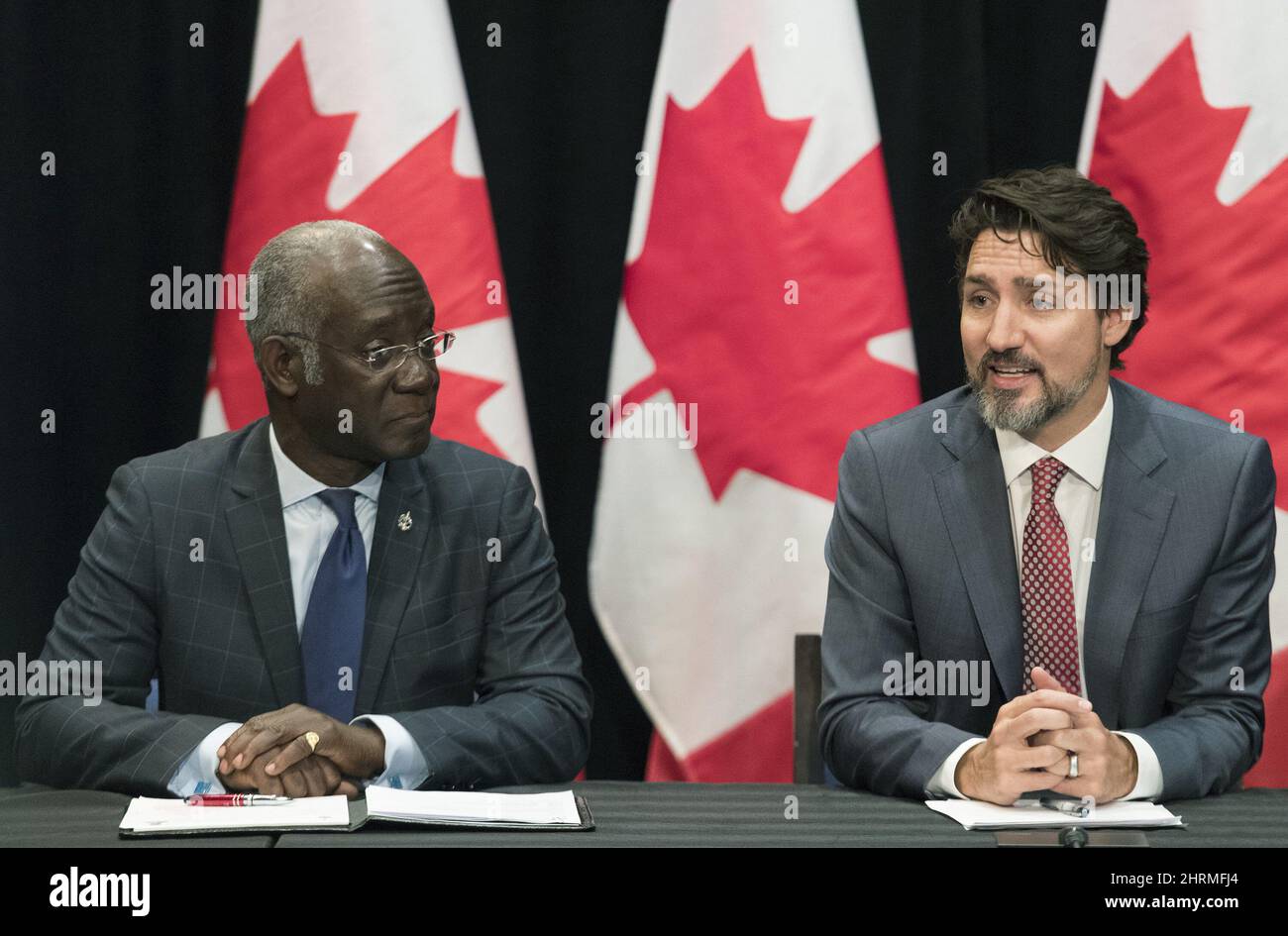 Prime Minister Justin Trudeau, right, and Bourassa MP Emmanuel Dubourg ...