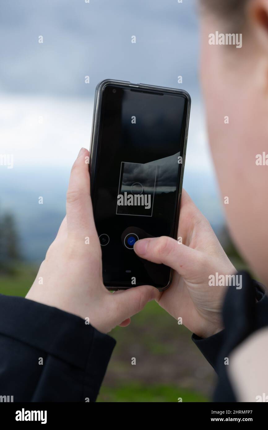 Man taking a picture with a mobile phone Stock Photo - Alamy