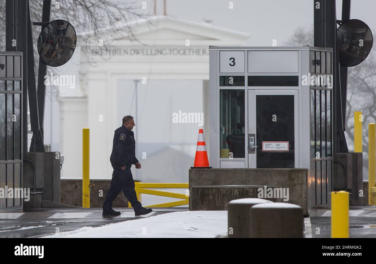 A Canada Border Services Agency officer walks between primary ...