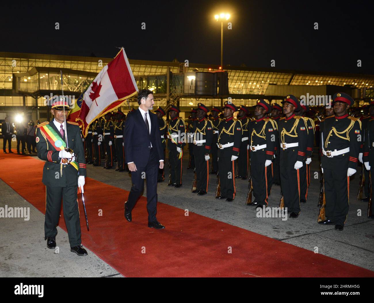Prime Minister Justin Trudeau inspects an honour guard as he arrives in ...