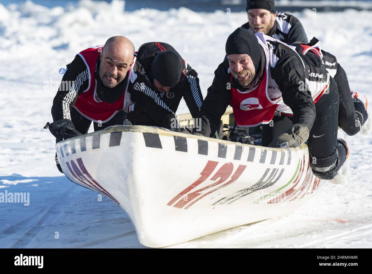 Team Latulippe push their canoe on the ice after crossing the St ...