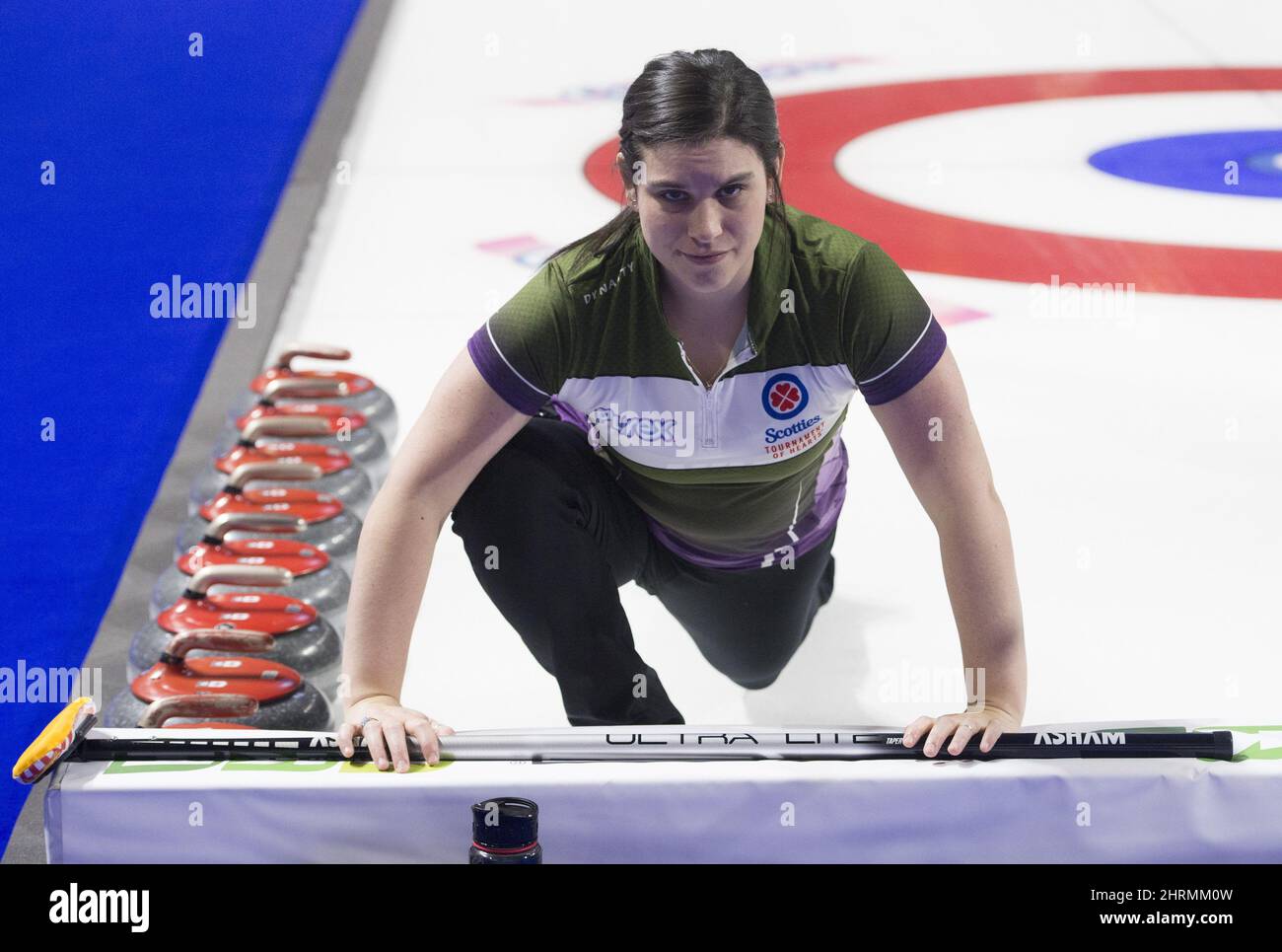 Team P.E.I. lead Michelle McQuaid stretches prior to draw 4 against ...
