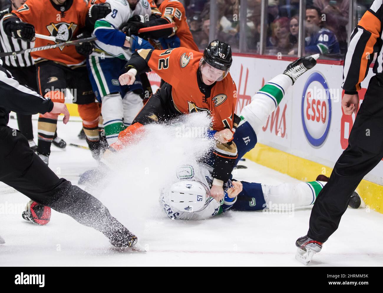 Anaheim Ducks' Josh Manson (42) punches Vancouver Canucks' Tyler Myers ...