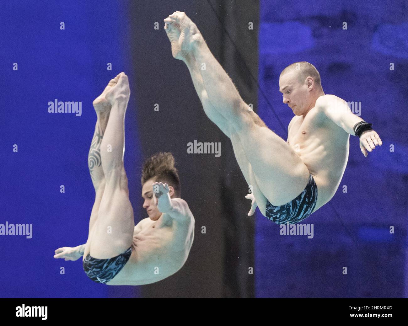 Evgenii Kuznetsov and Nikita Shleikher of the Russian Federation perform a dive during the men's ...