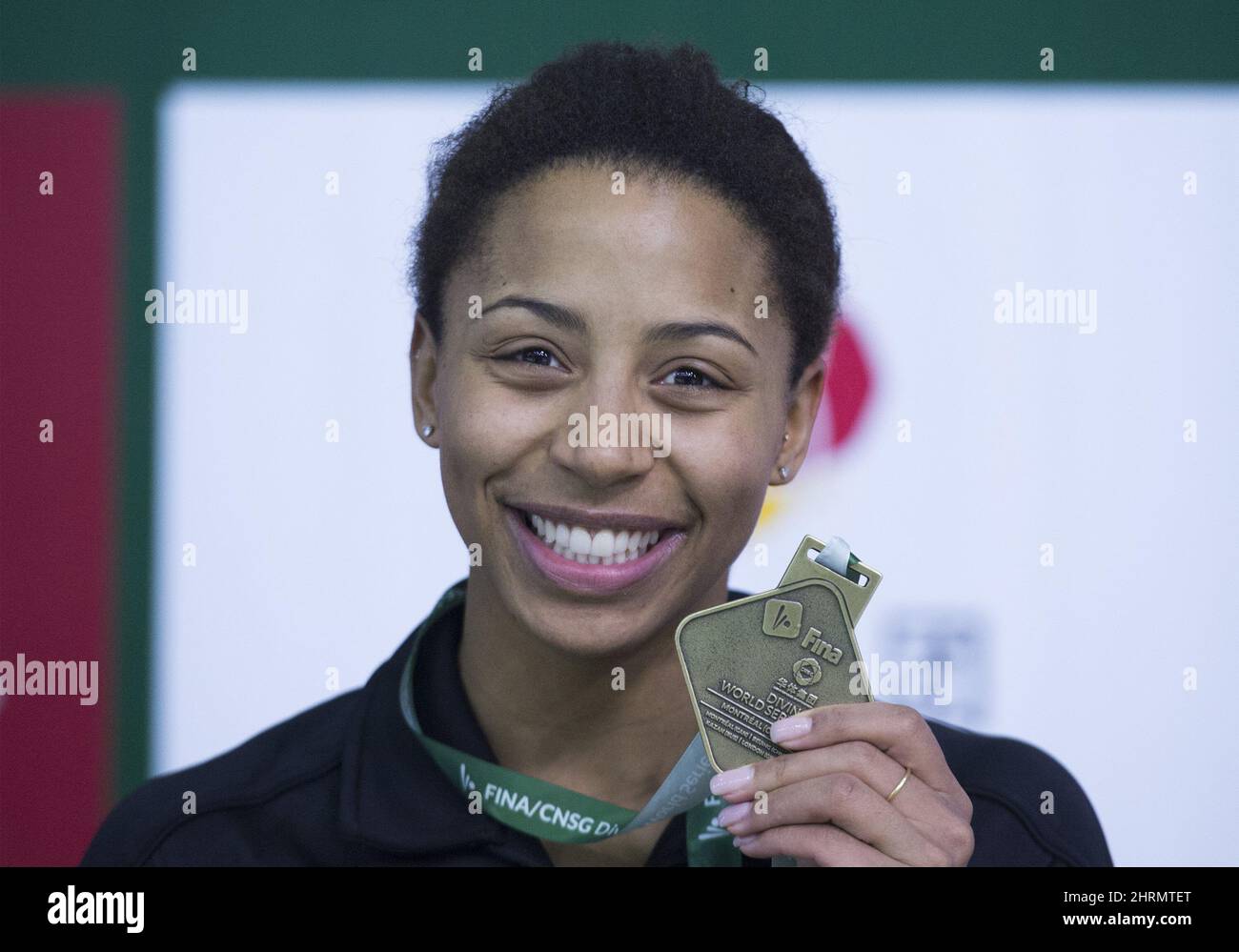 Jennifer Abel of Canada holds up her gold medal after winning the women ...