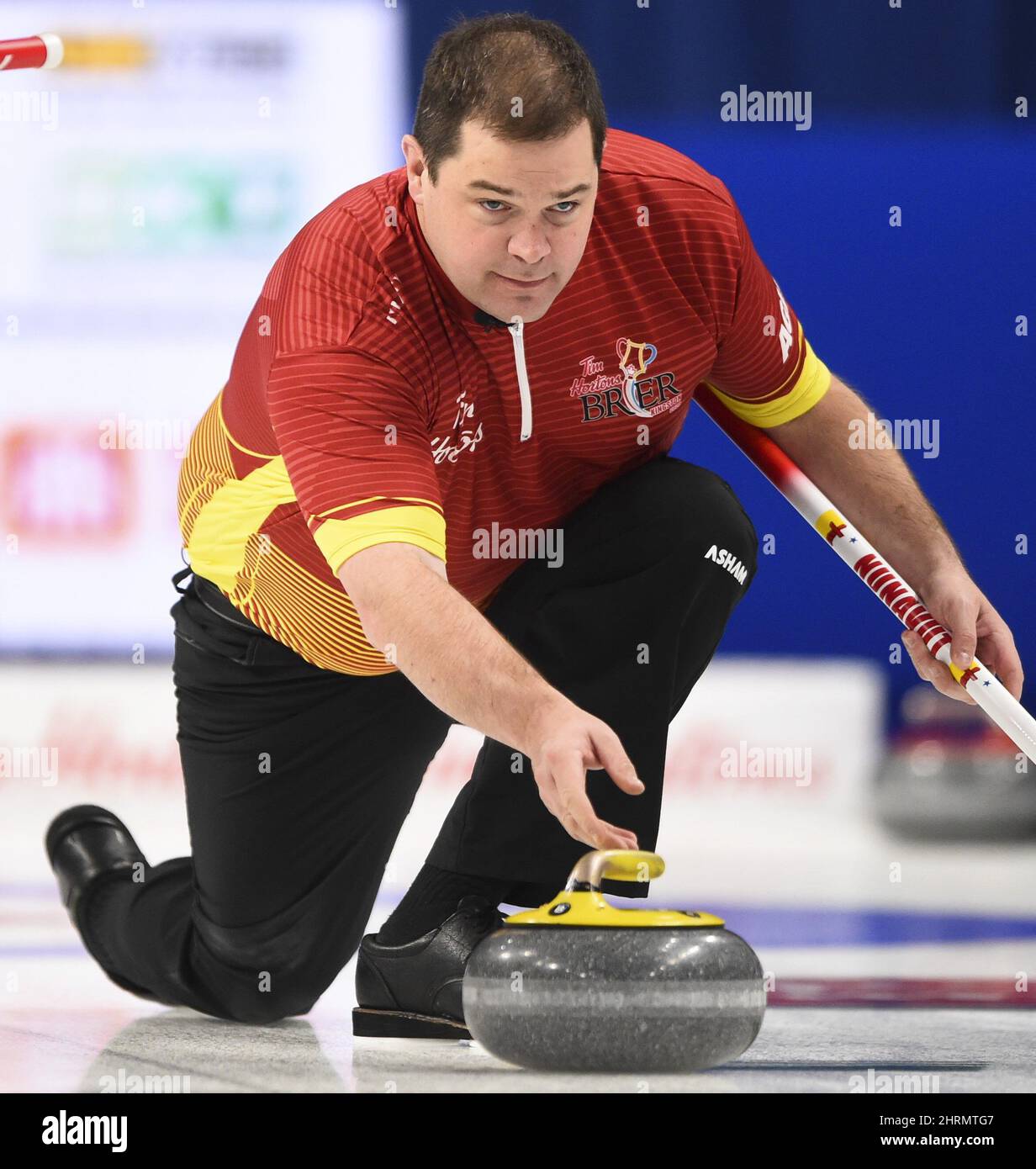 Team Nunavut skip Jake Higgs delivers the stone as he takes on Quebec ...