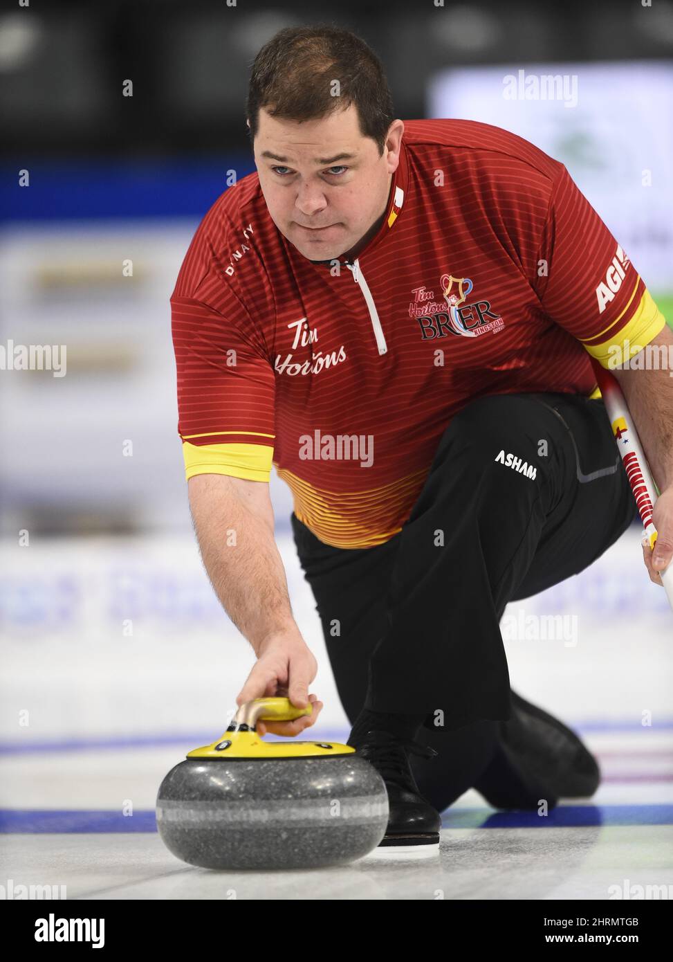 Team Nunavut skip Jake Higgs delivers the stone as he takes on Quebec ...