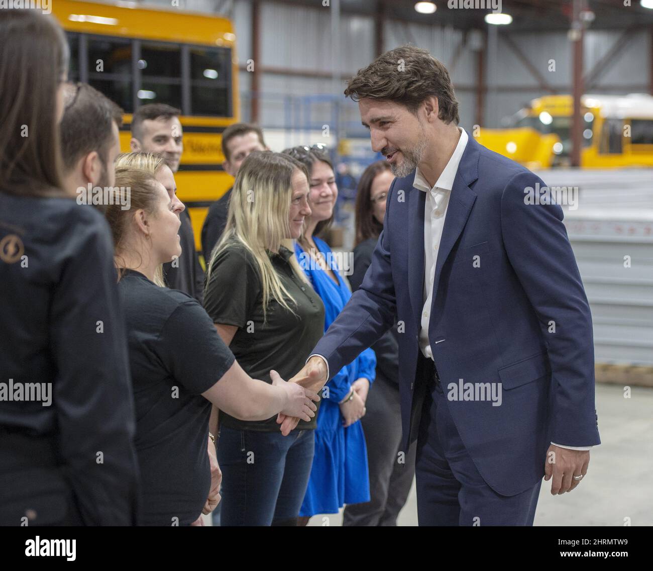 Prime Minister Justin Trudeau greets employees while touring the Lion ...