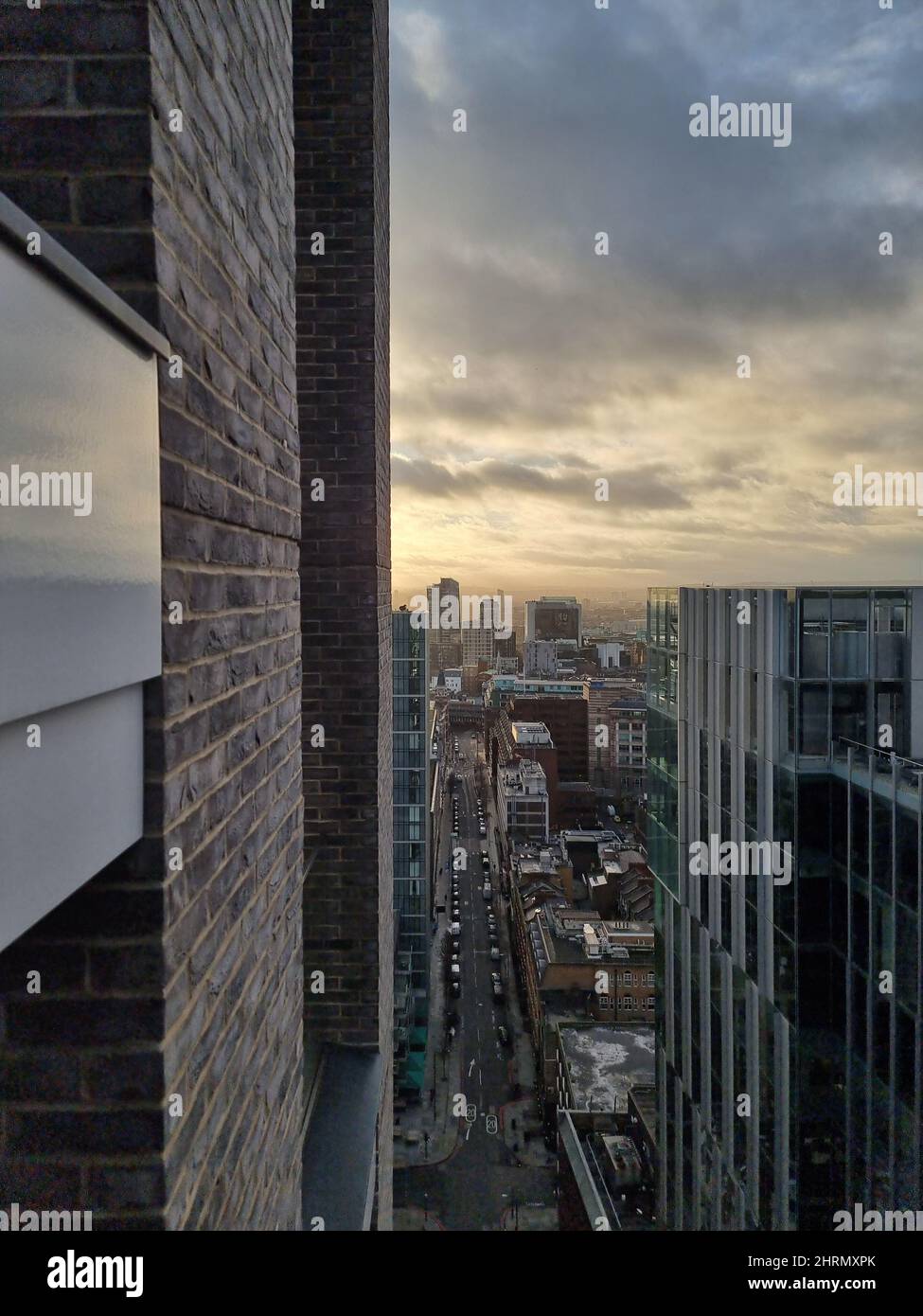 Vertical shot of the road and city architecture seen from a tall ...