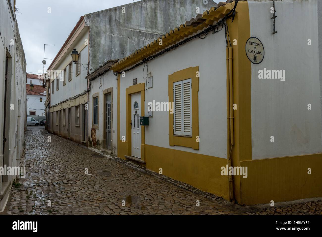 Rainy day in a small Portuguese town with typical buildings in Loule ...